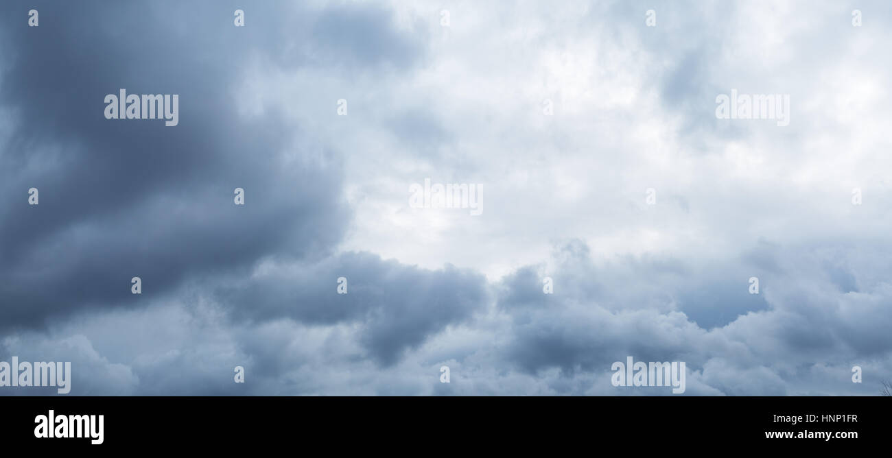 Heavy grey clouds in the sky before snow falling Stock Photo - Alamy