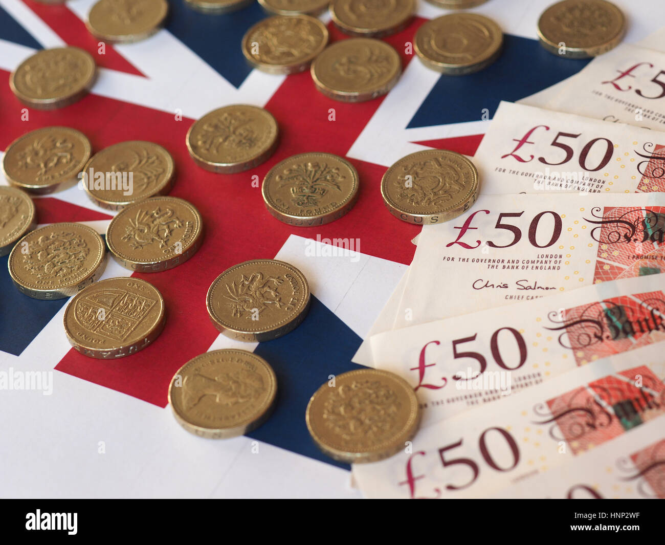 Pound coins and banknotes money (GBP), currency of United Kingdom, over ...
