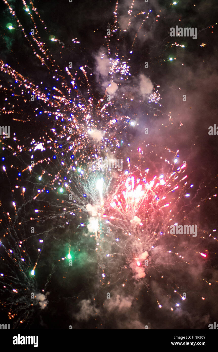 Bright firework explosions on the night sky Stock Photo - Alamy