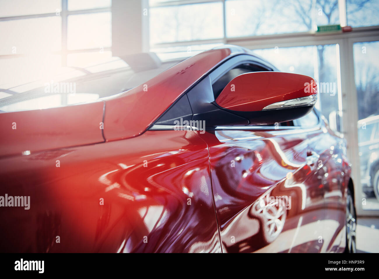 Headlights and hood of sport red car Stock Photo - Alamy