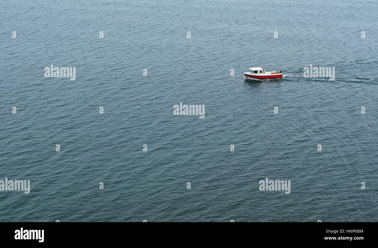 Small boat sailing on the sea Stock Photo - Alamy