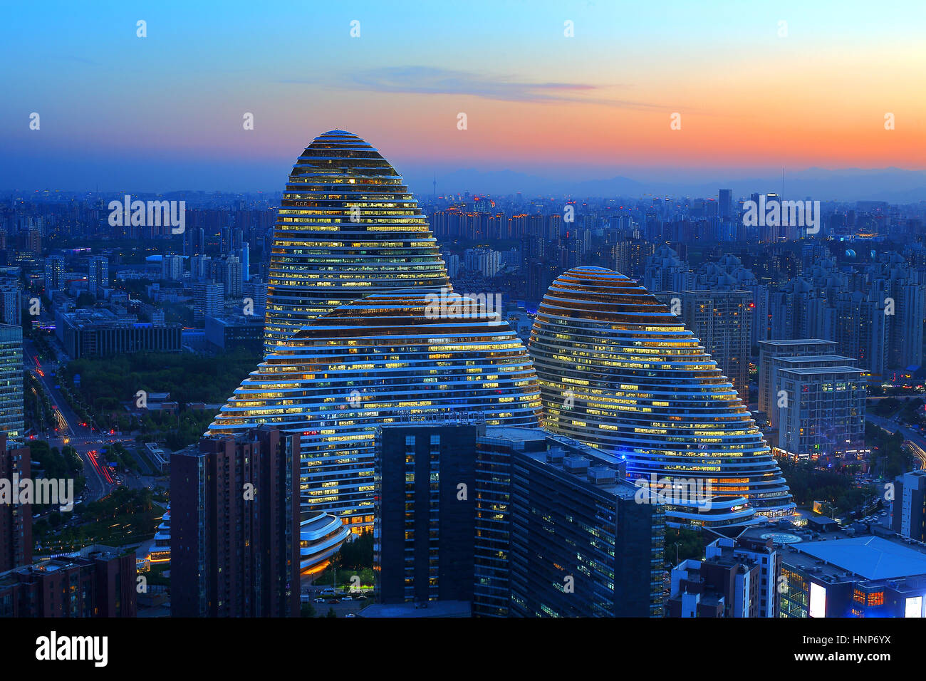 Wangjing Beijing SOHO city building night view Stock Photo - Alamy