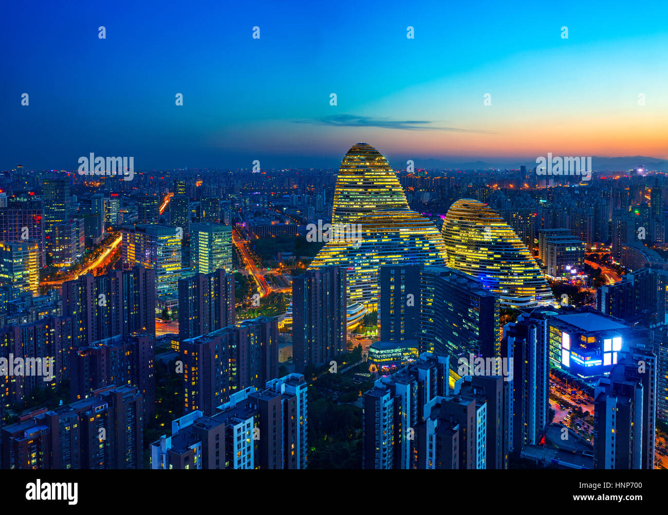 Wangjing Beijing SOHO city building night view Stock Photo - Alamy