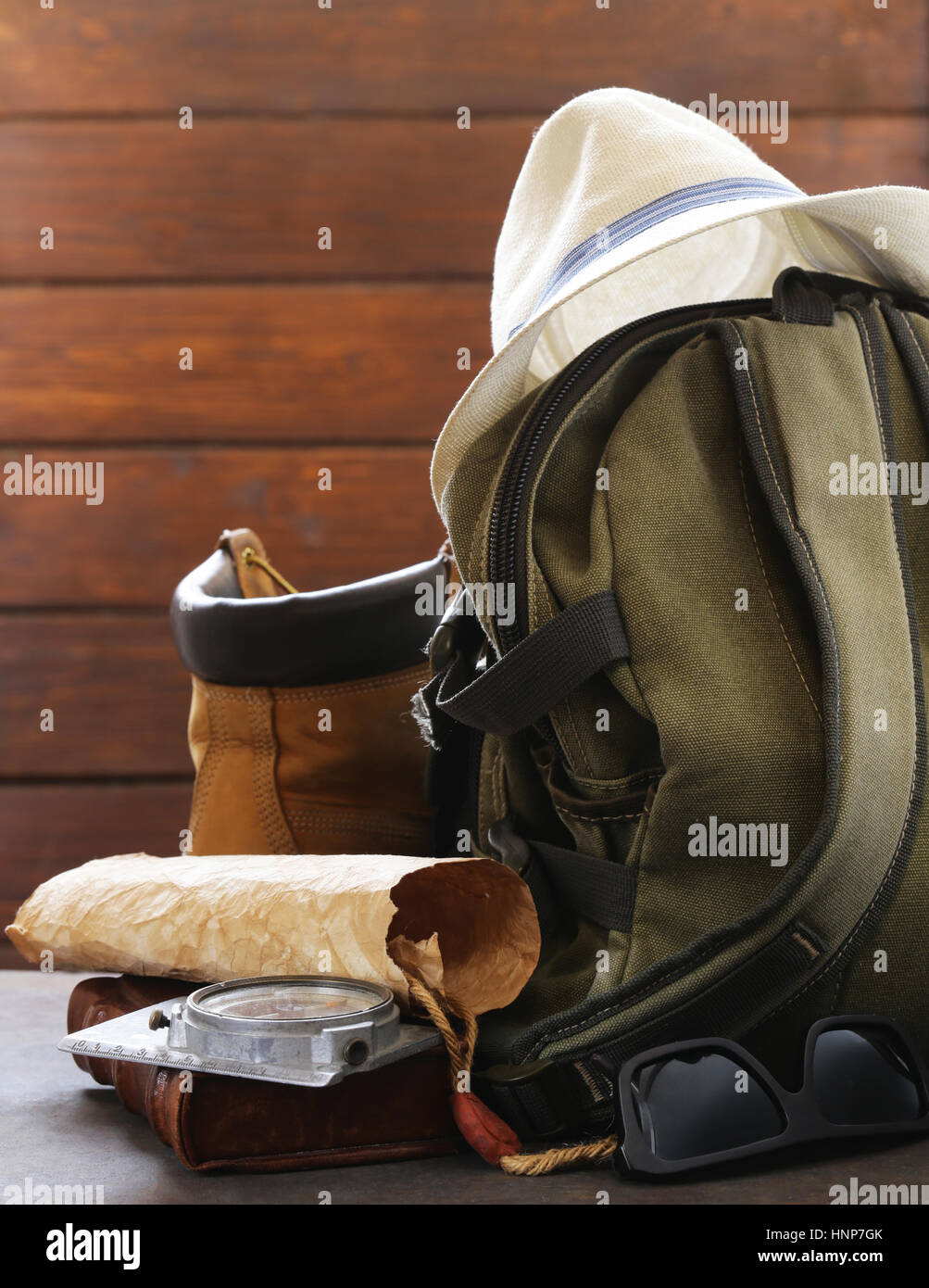 travel concept - backpack, compass, map and accessories Stock Photo - Alamy