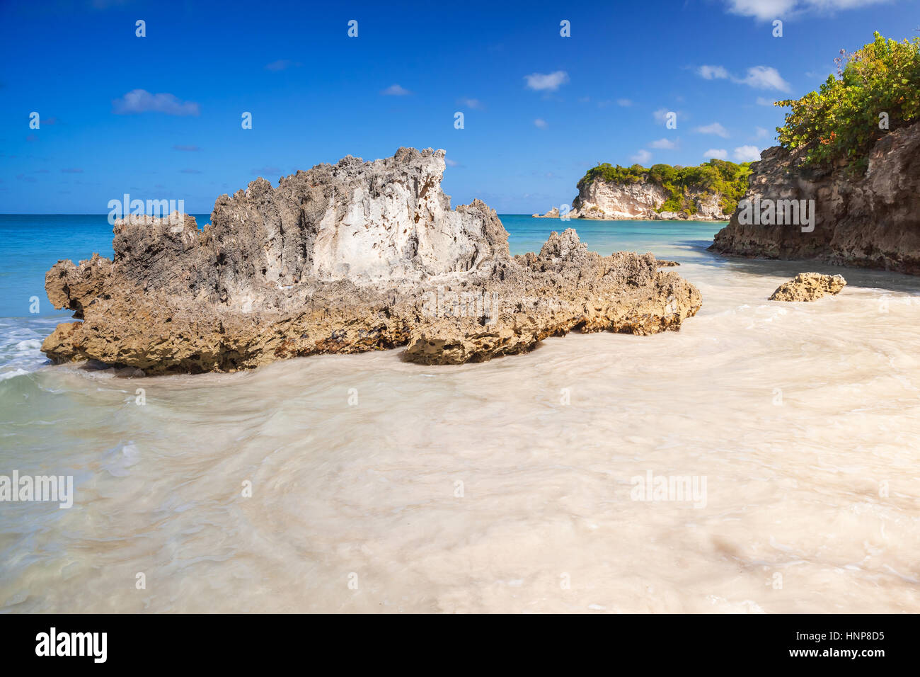 Coastal rocks and sand of Macao Beach, touristic resort of Dominican ...