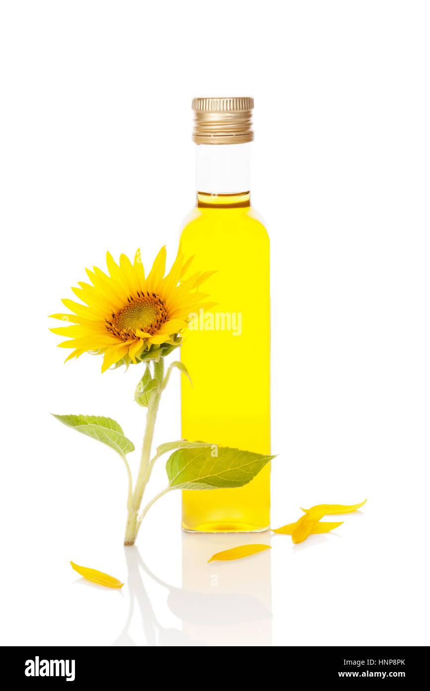Sunflower oil in glass bottle and fresh sun-flower isolated on white ...