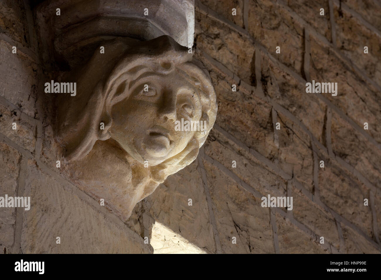 Stone carving of woman`s head in St. Michael and All Angels Church ...