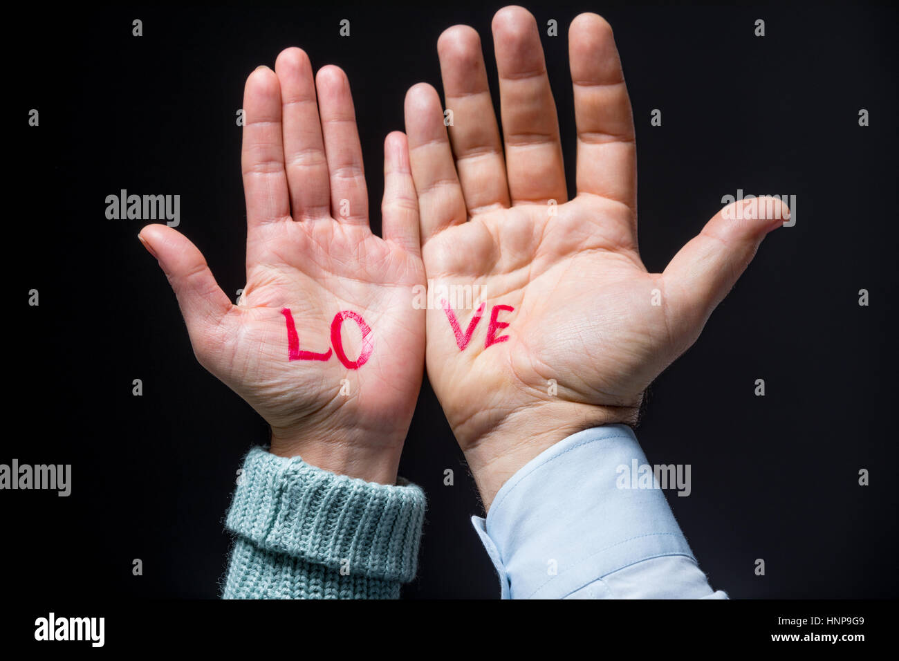 Hands with word love Stock Photo - Alamy