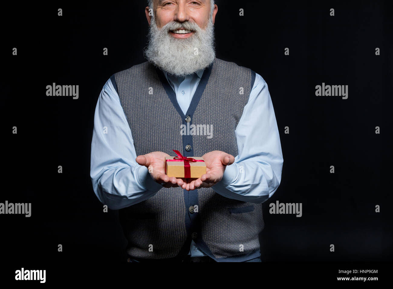 Man holding gift Stock Photo - Alamy