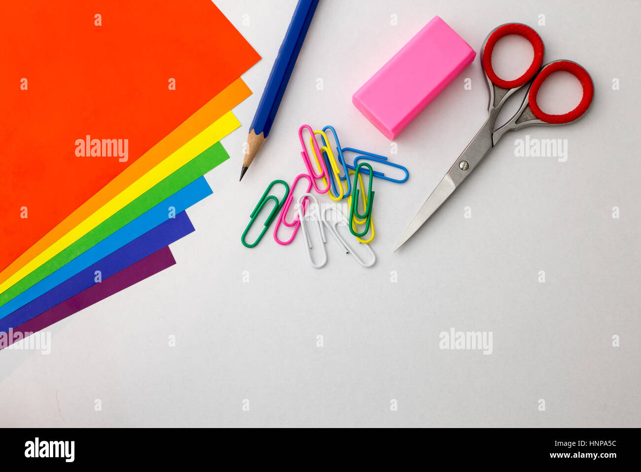 Office supplies with rainbow colors of papers Stock Photo - Alamy