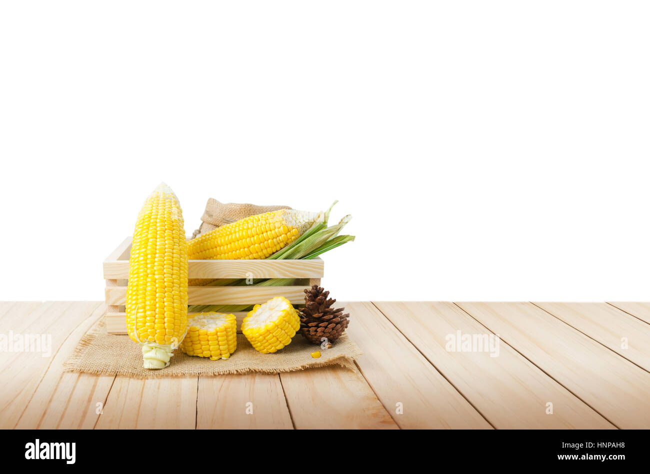 Close up fresh nature corn on hemp sack and wood box on wood floor and ...