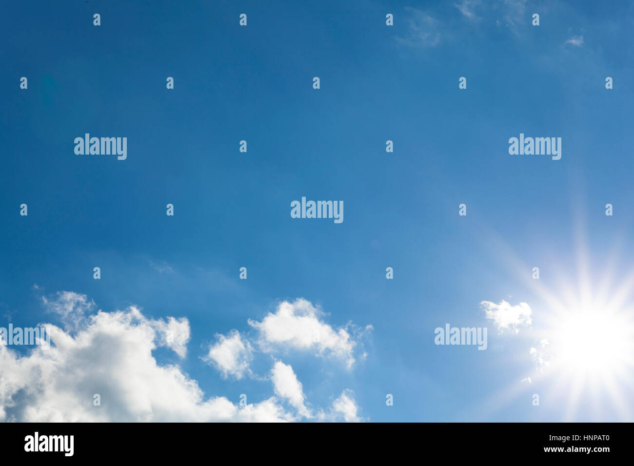Bright sunshine on a blue sky Stock Photo - Alamy