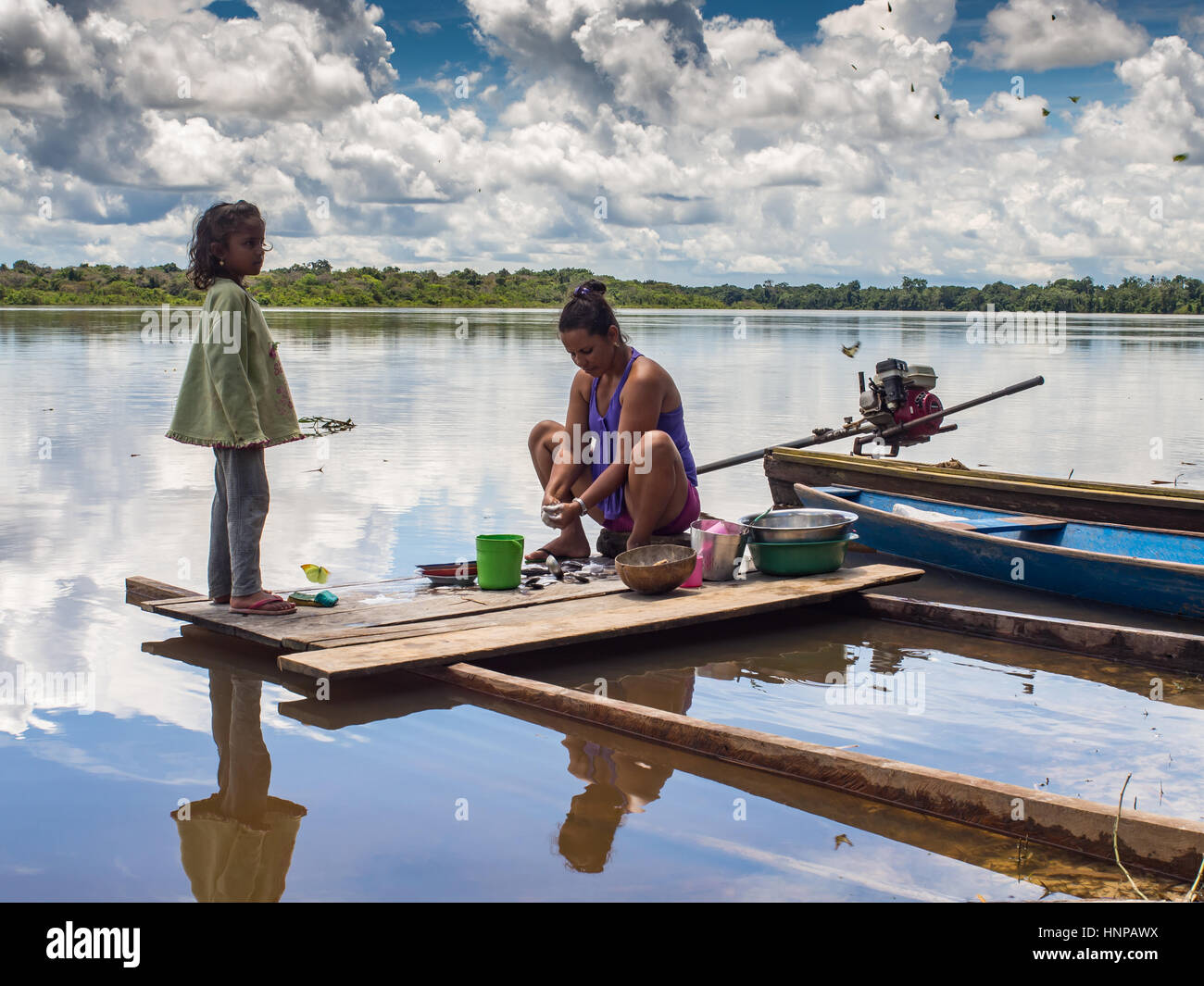 Child washing in river hi-res stock photography and images - Alamy