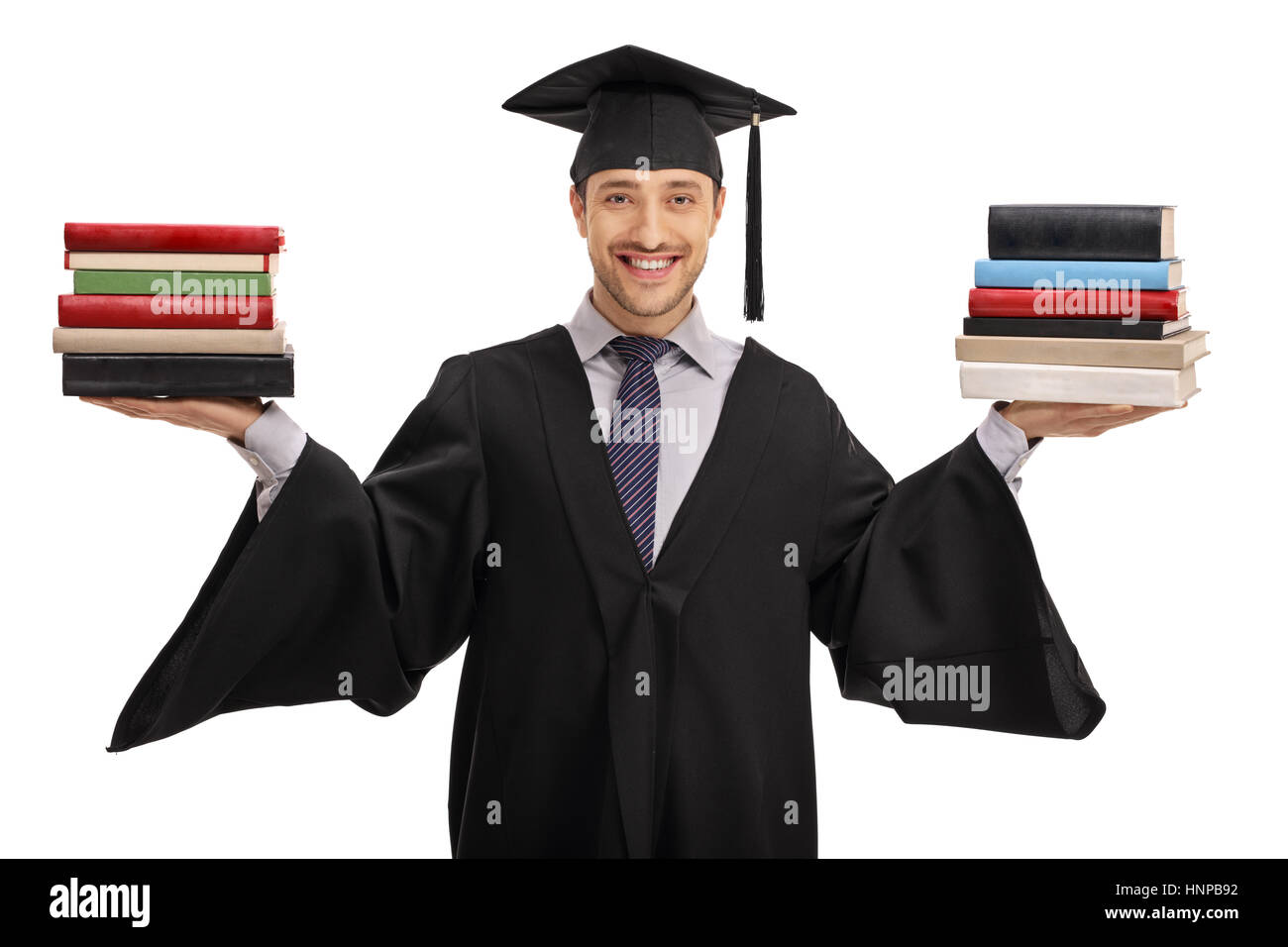 Happy graduate student holding two stacks of books isolated on white ...