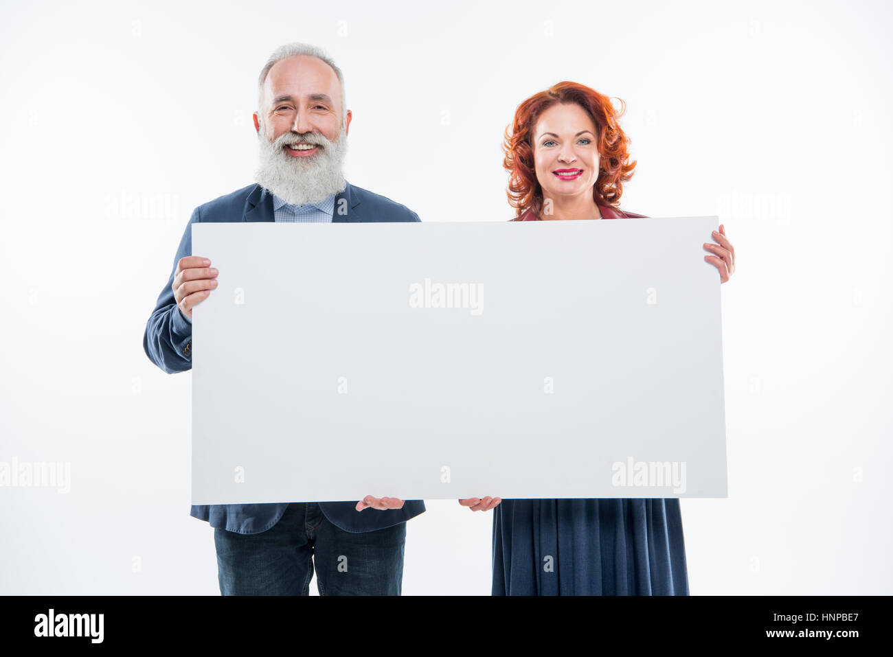 Couple holding blank card Stock Photo - Alamy