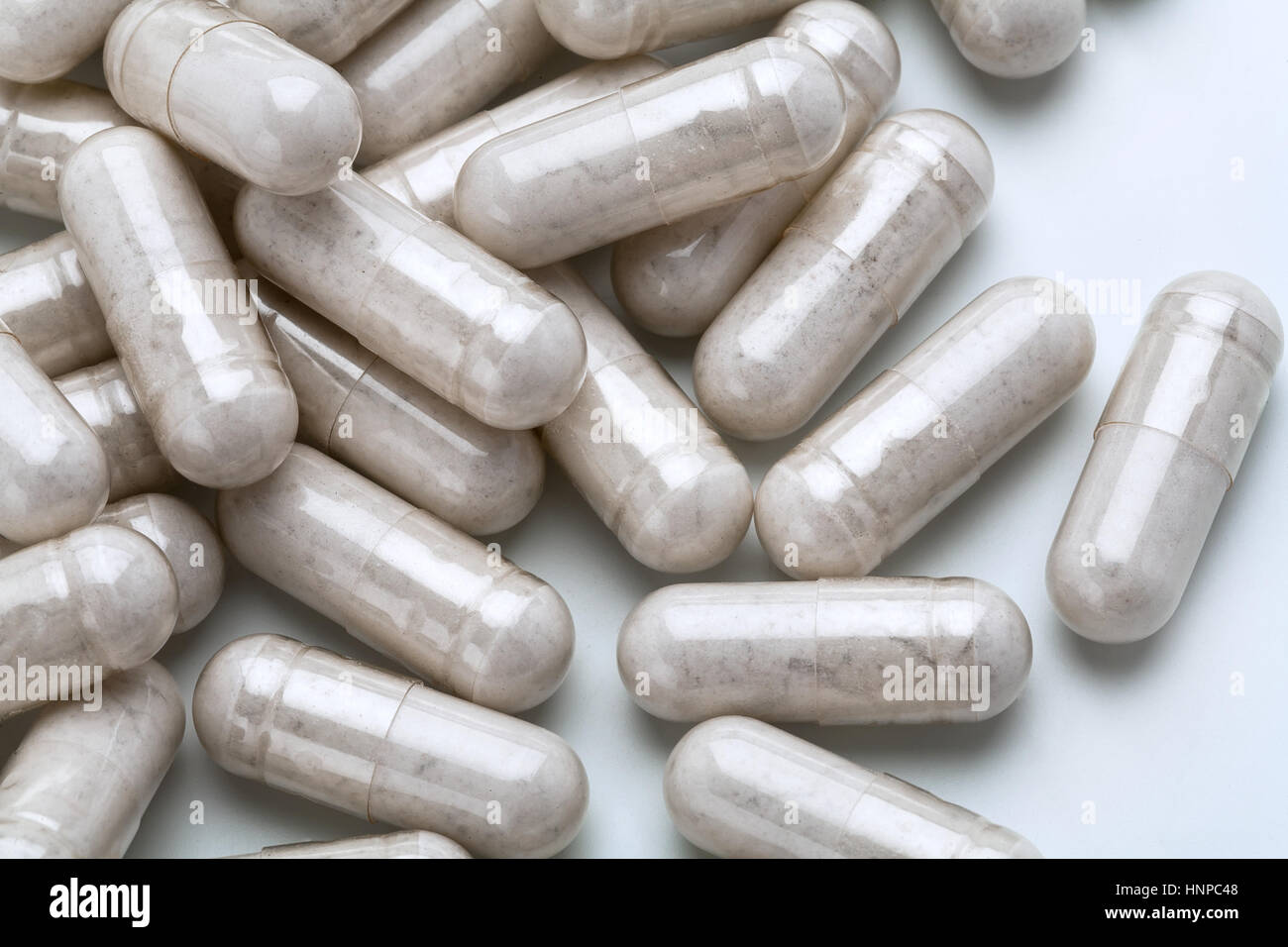 Close up pile of capsules probiotic powder inside. Top view, high ...