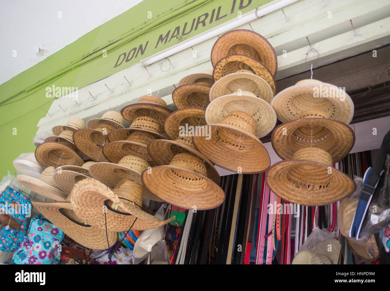 A collection of hats of diferent designs made of thatch Stock Photo - Alamy