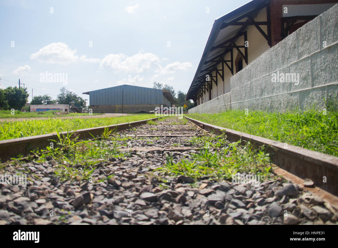 A low point of view of a urban train tracks Stock Photo - Alamy
