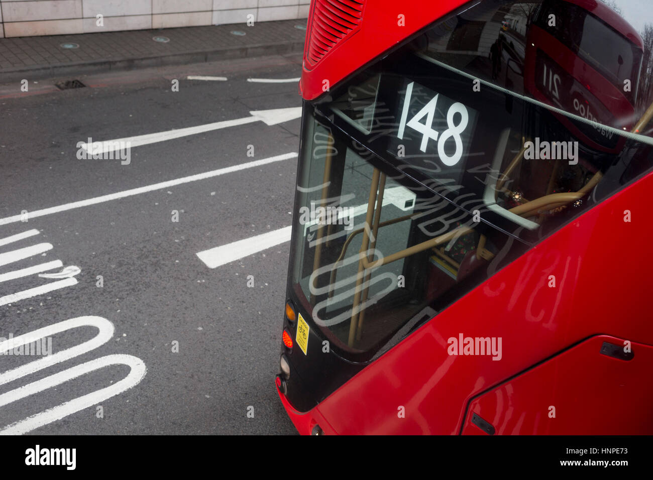Aerial view of the rear of a number 148 red London Routemaster bus, on ...