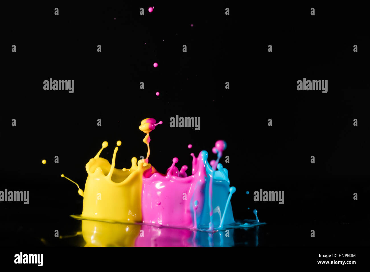 Аbstract sculptures of colorful splashes of paint. Dancing liquid on a ...