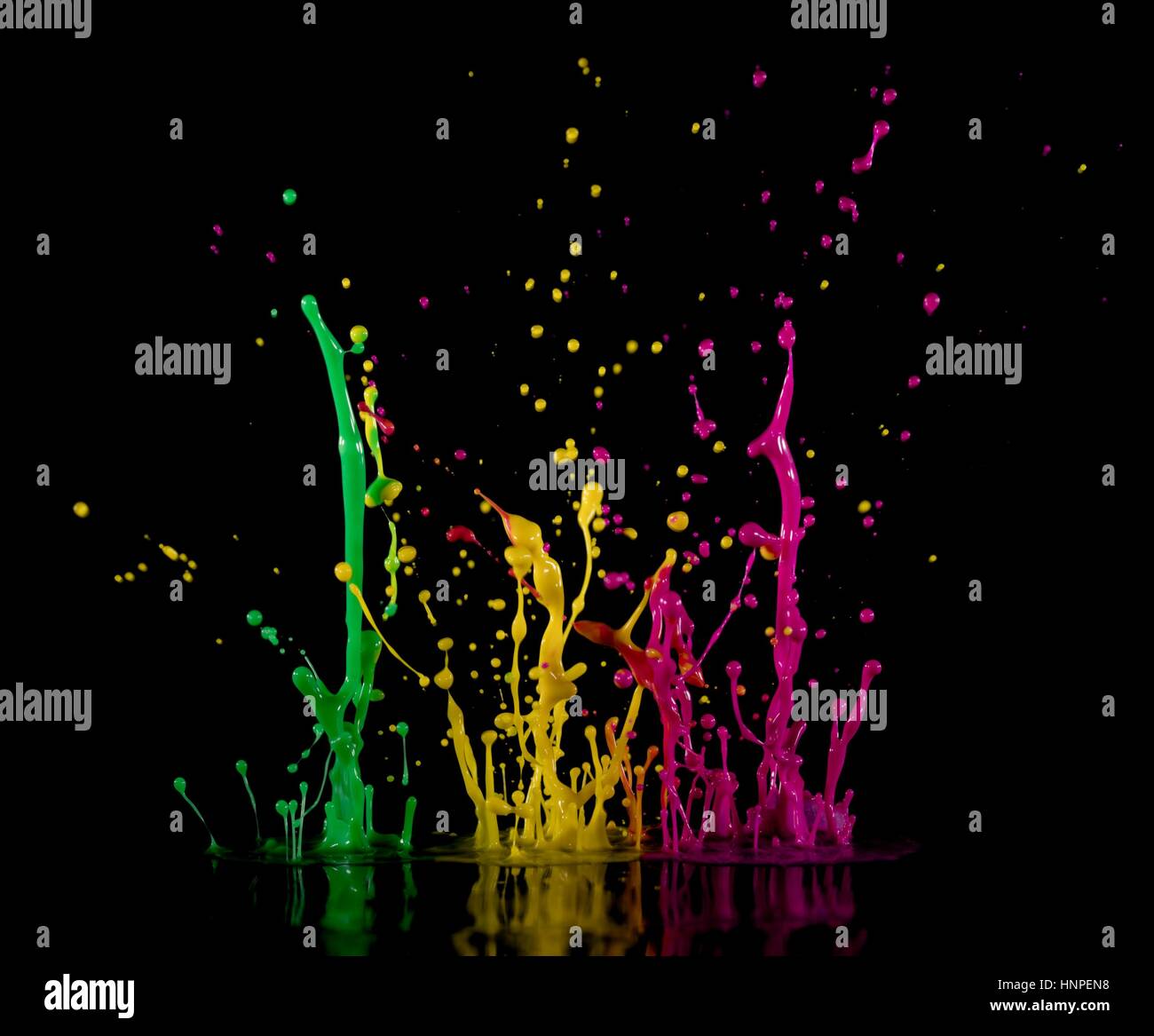 Abstract sculptures of colorful splashes of paint. Dancing liquid on a ...