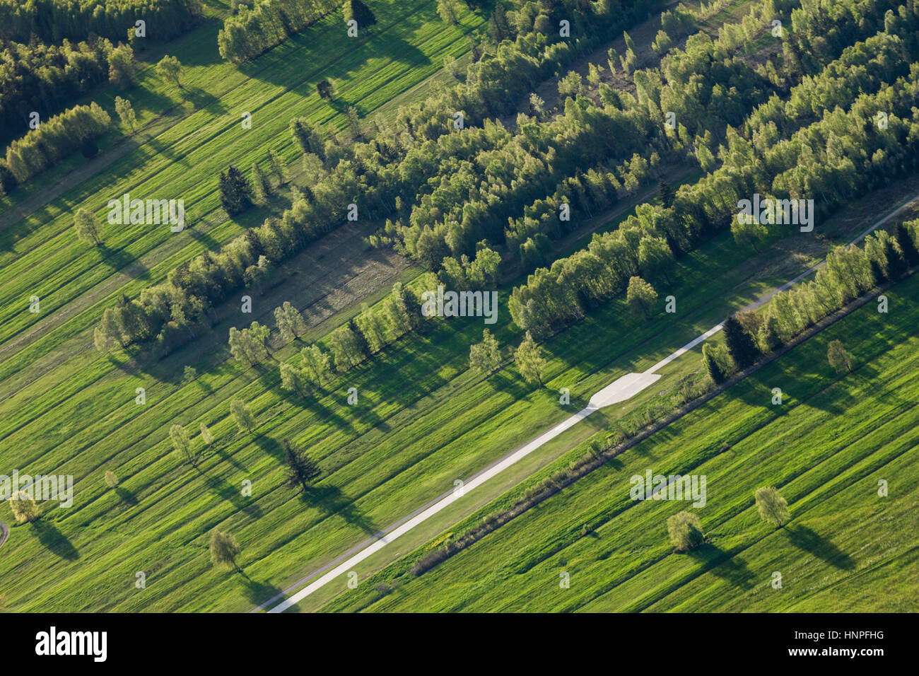 Man-made landscape. Furrowed fields. Structure of stripes and rows ...