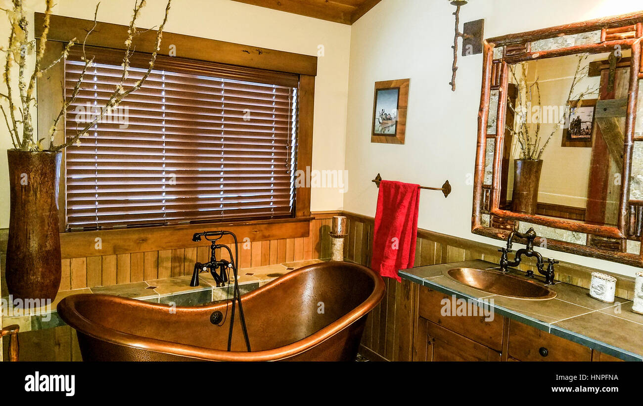 Rustic bathroom with copper tub in River Ranch Trapper Cabin, a trapper ...