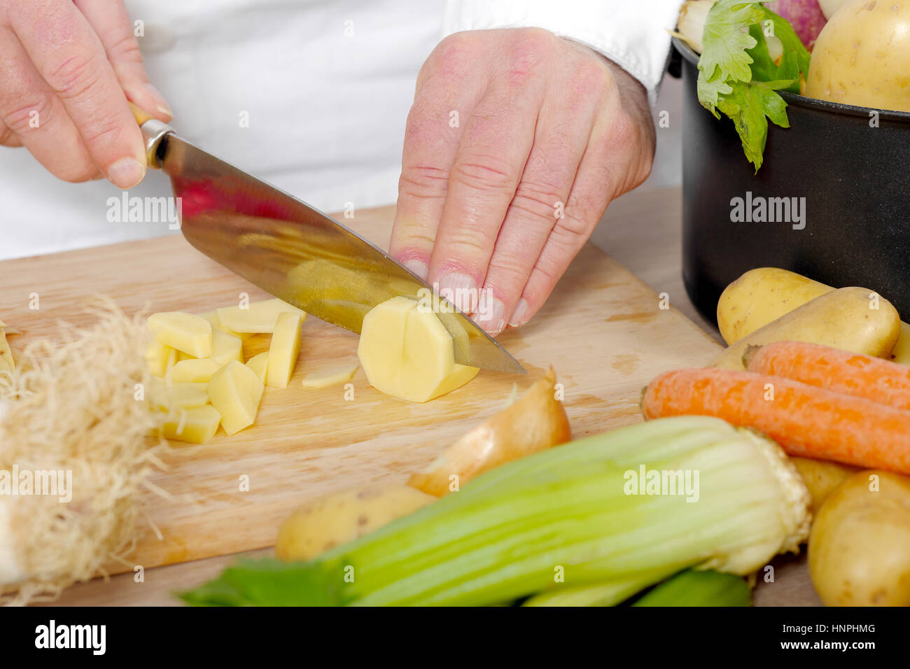 Chef cutting slicing peeled potato hi-res stock photography and images ...