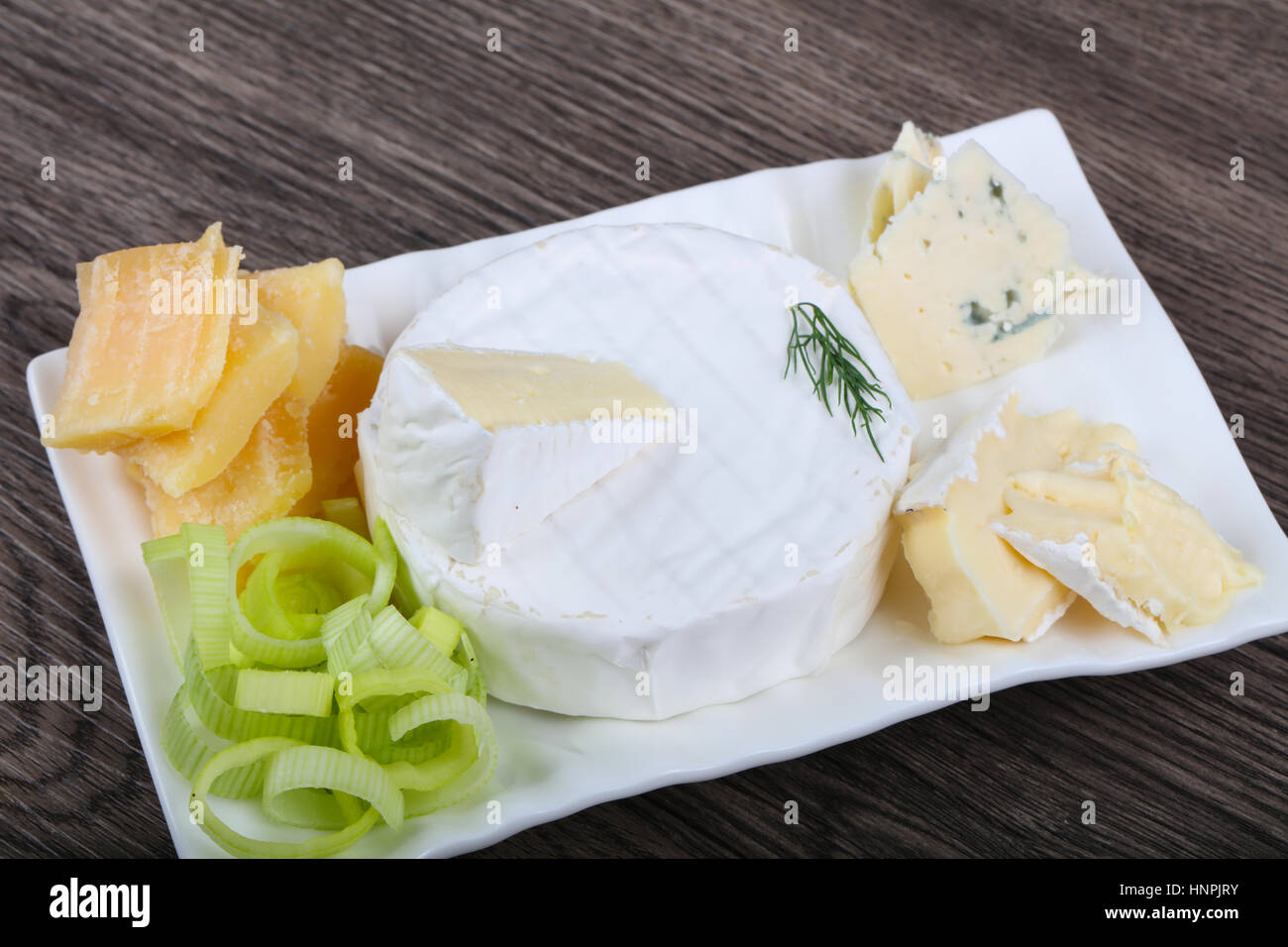 Cheese platter with brie, blue and parmesan Stock Photo - Alamy