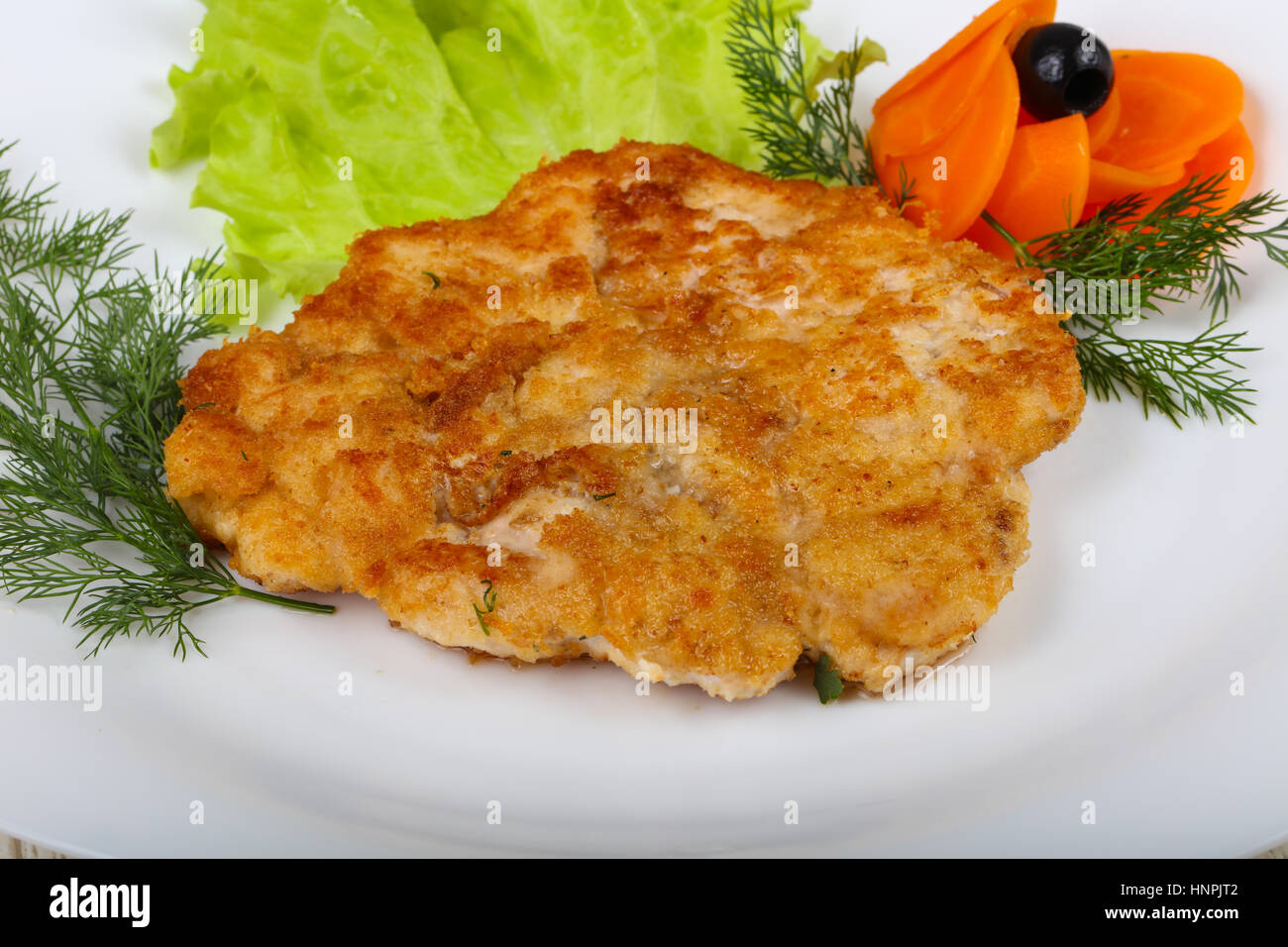 Chicken schnitzel served salad leaves and dill Stock Photo - Alamy