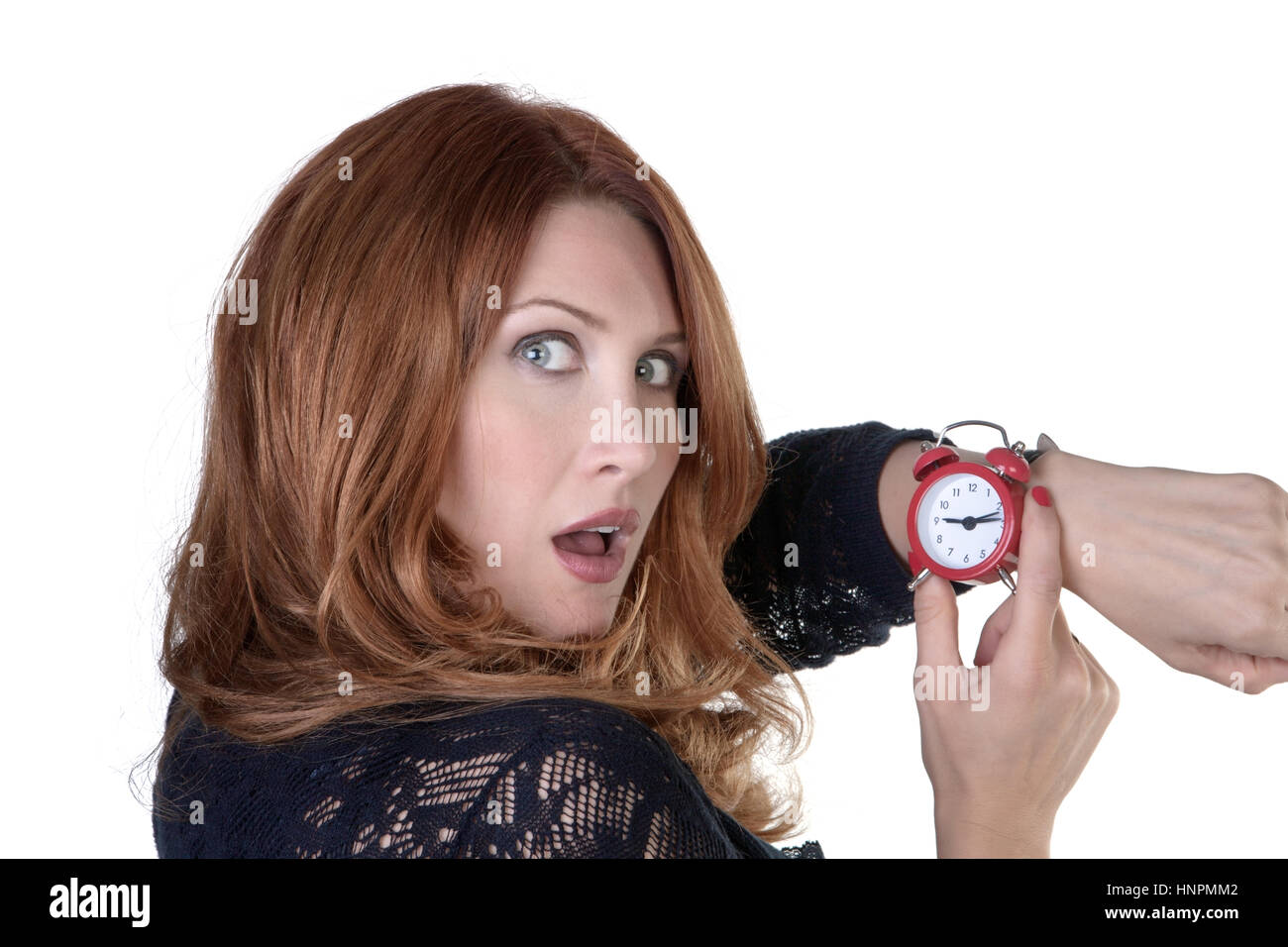 woman looking at her watch running late Stock Photo - Alamy