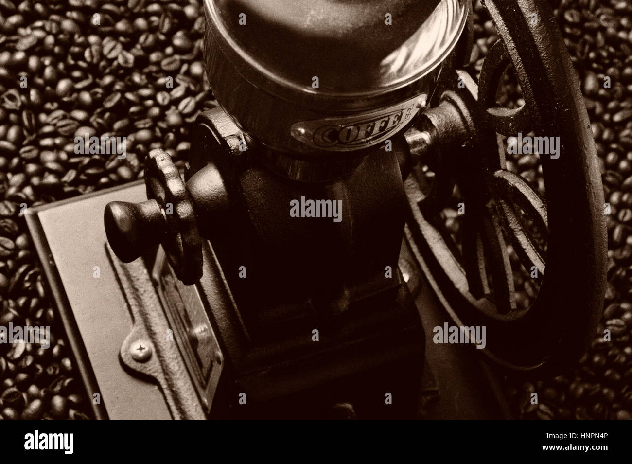 classical coffee grinder machine and coffee seeds Stock Photo - Alamy