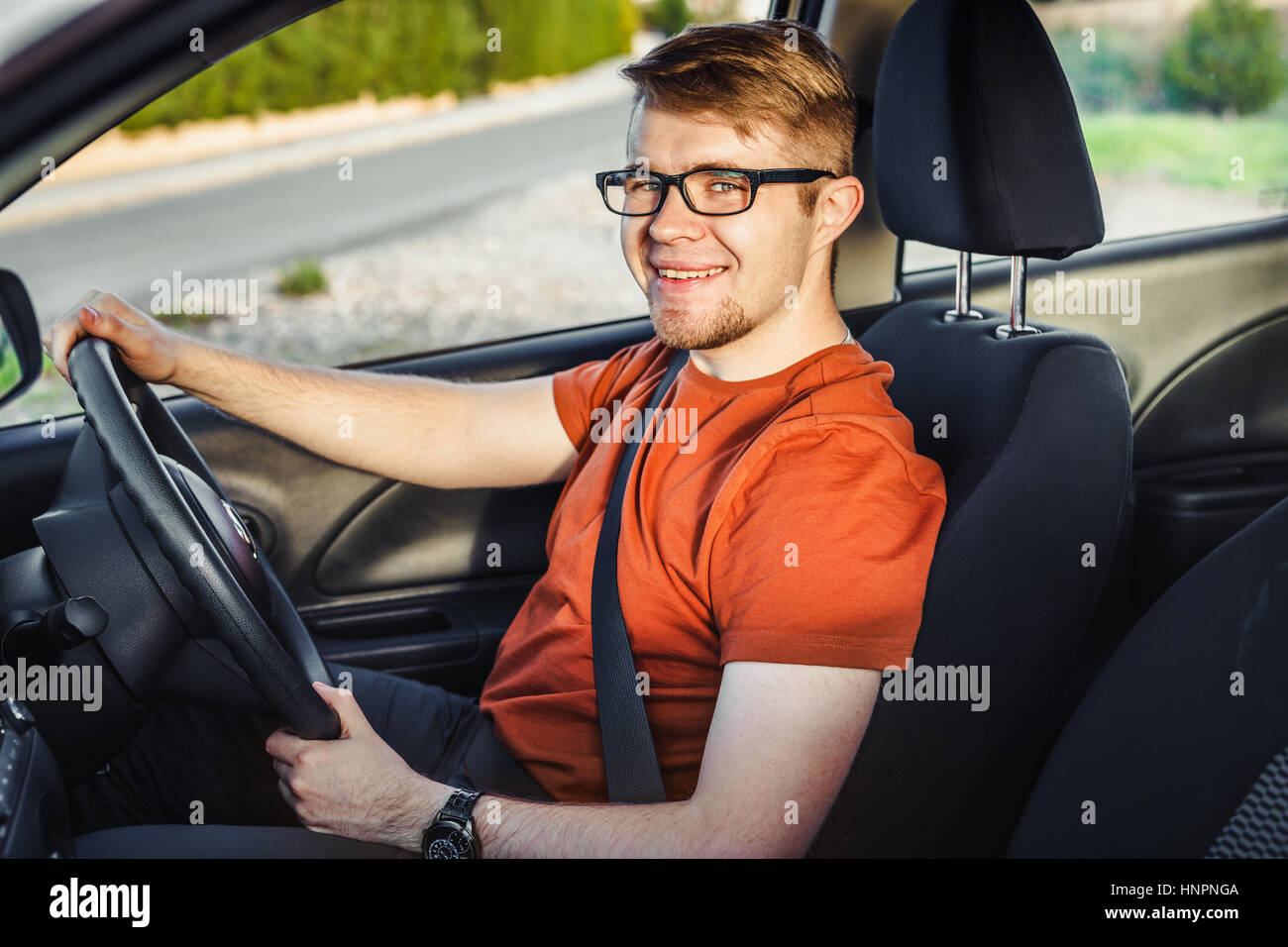 Happy handsome man in his new car Stock Photo - Alamy