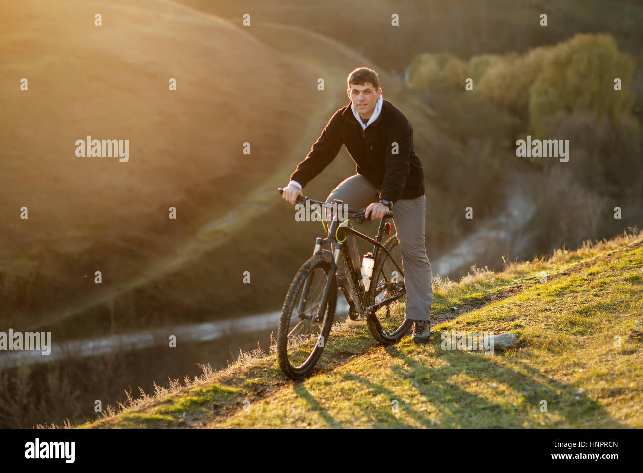 Cyclist Riding the Bike on the Beautiful Spring Mountain Trail Stock ...