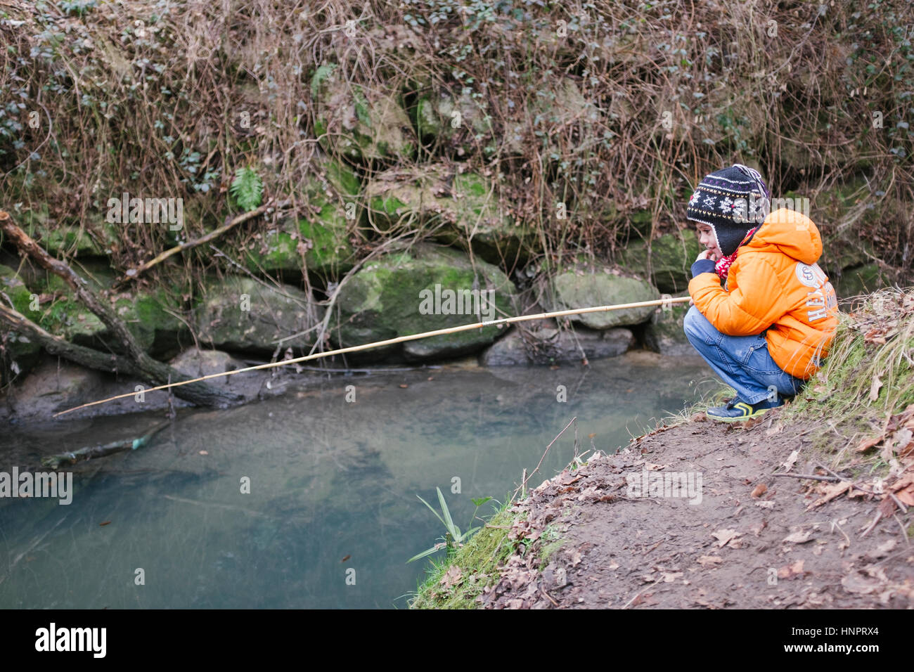 Children fishing on the river Stock Photo - Alamy