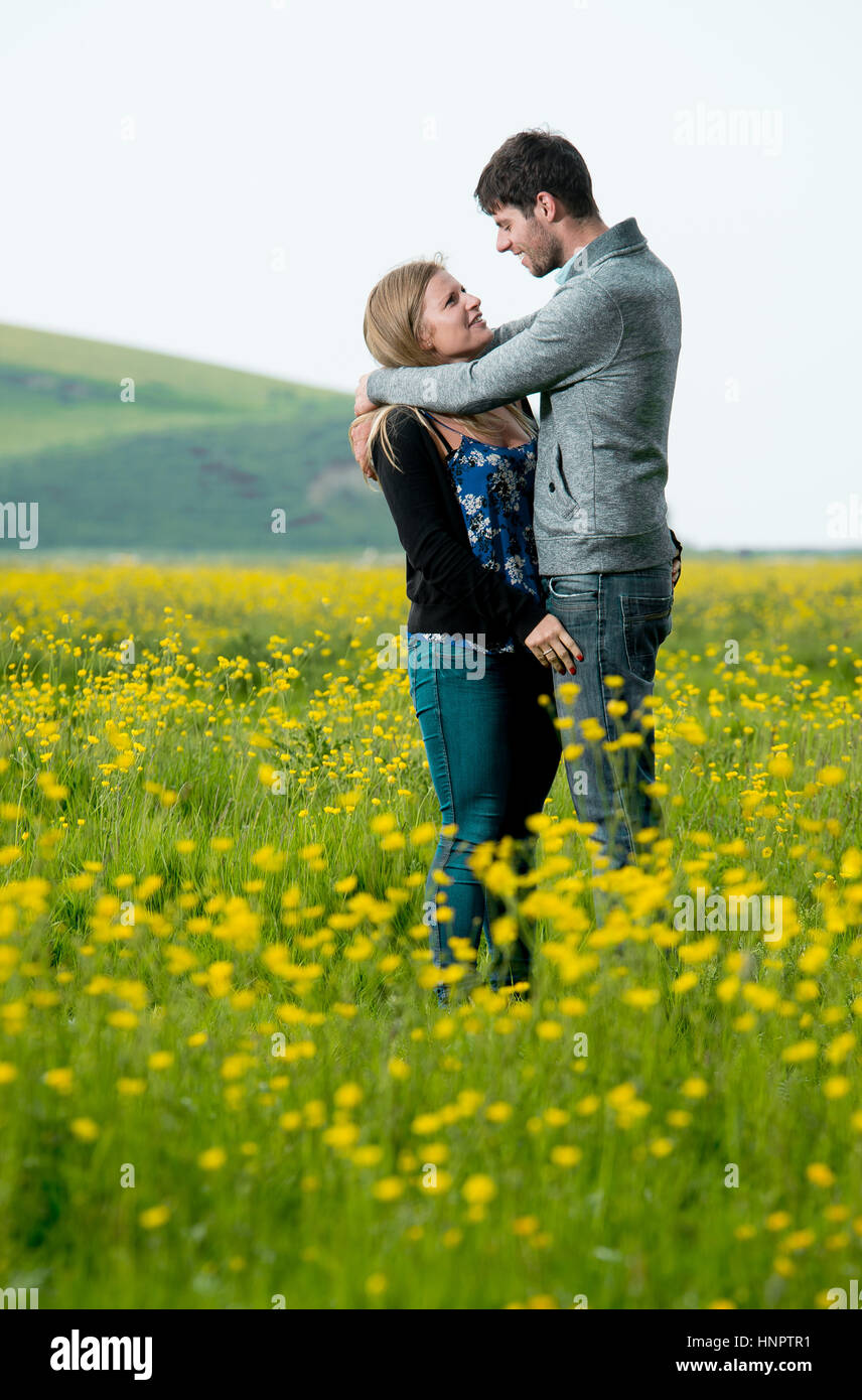 A couple recently engaged show their love for each other near seven ...