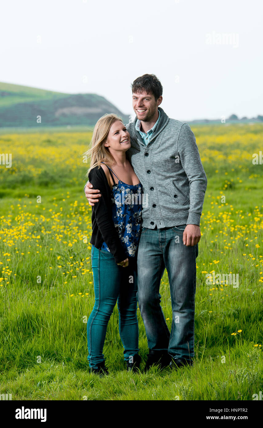 A couple recently engaged show their love for each other near seven ...