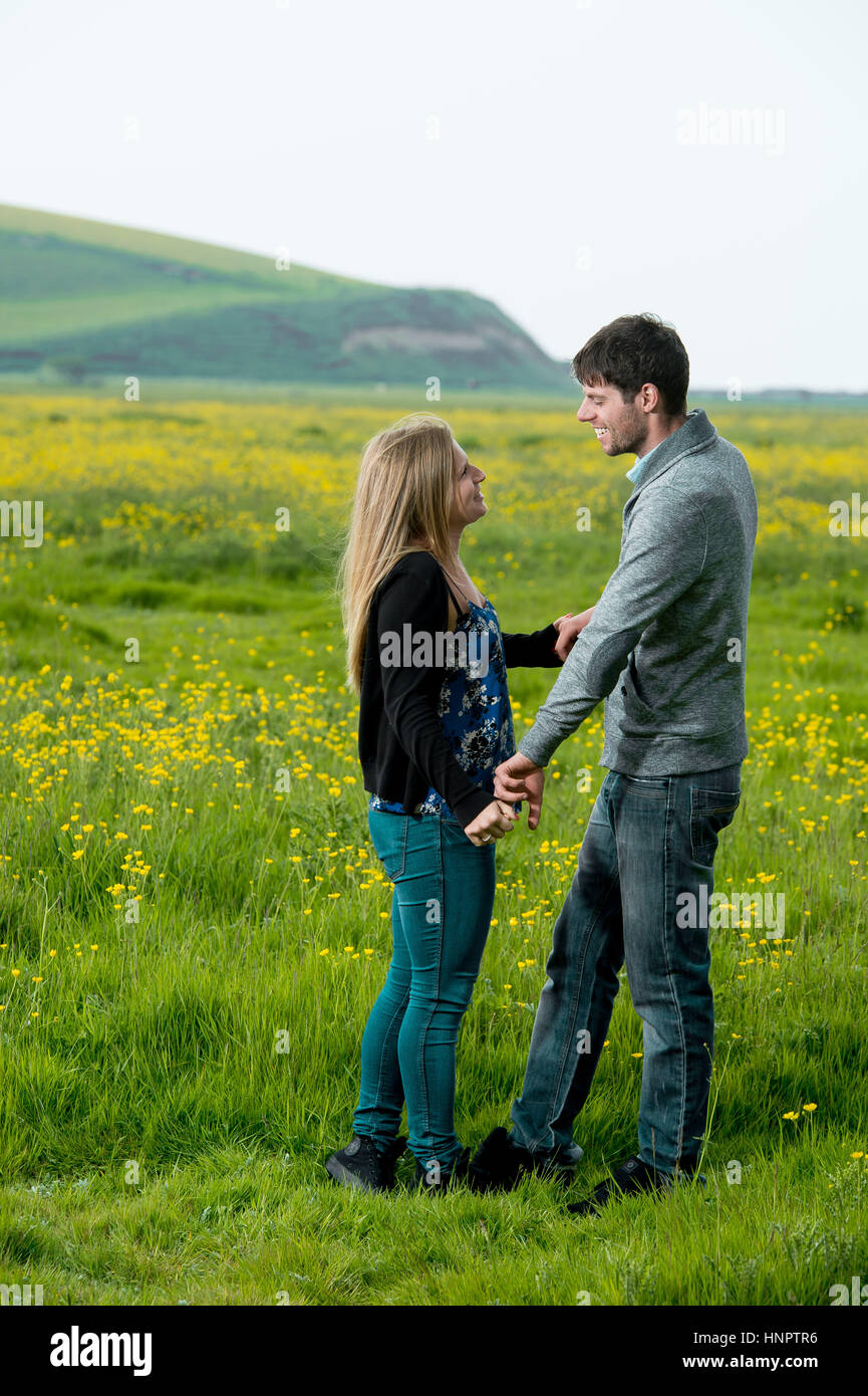 A couple recently engaged show their love for each other near seven ...