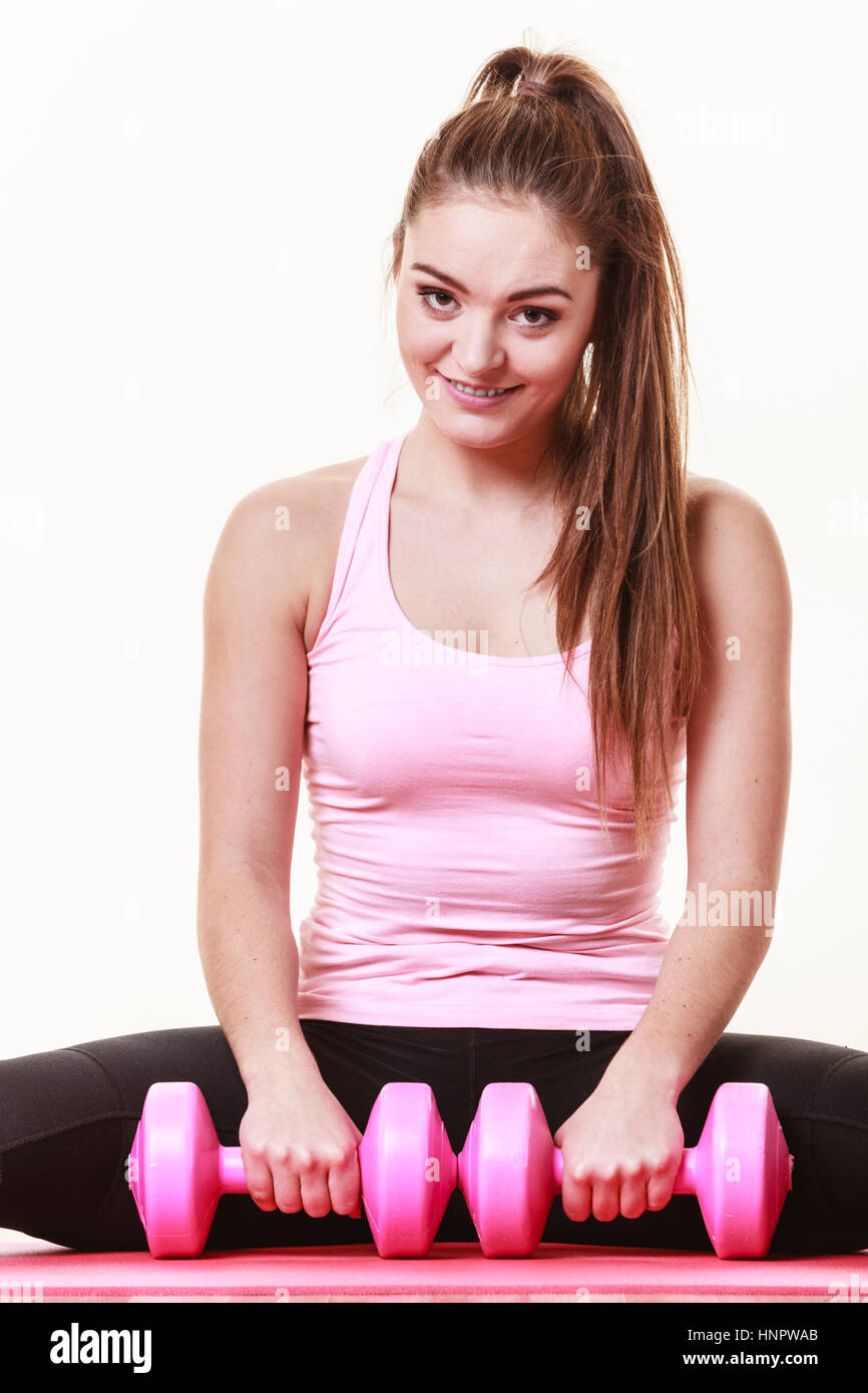 Health fitness sport shape concept. Cheerful girl lifting weights ...
