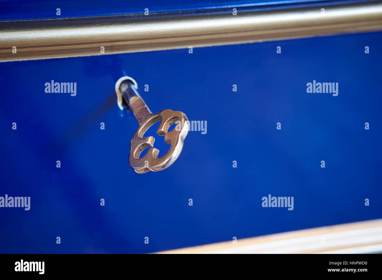 Antique key detail on a blue box background. Horizontal Stock Photo - Alamy