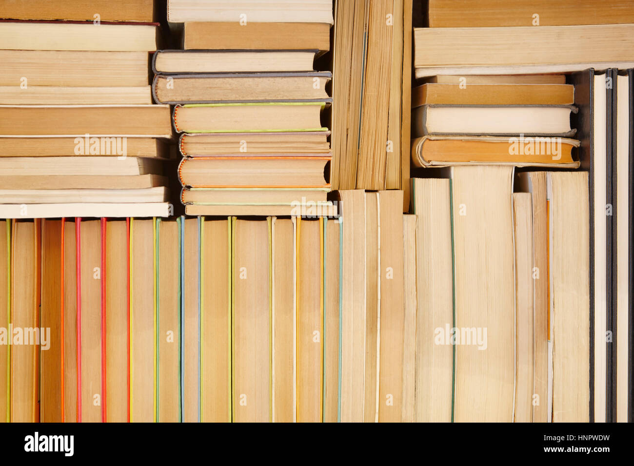 Antique books stacked on a storage rack. Read background. Culture Stock ...