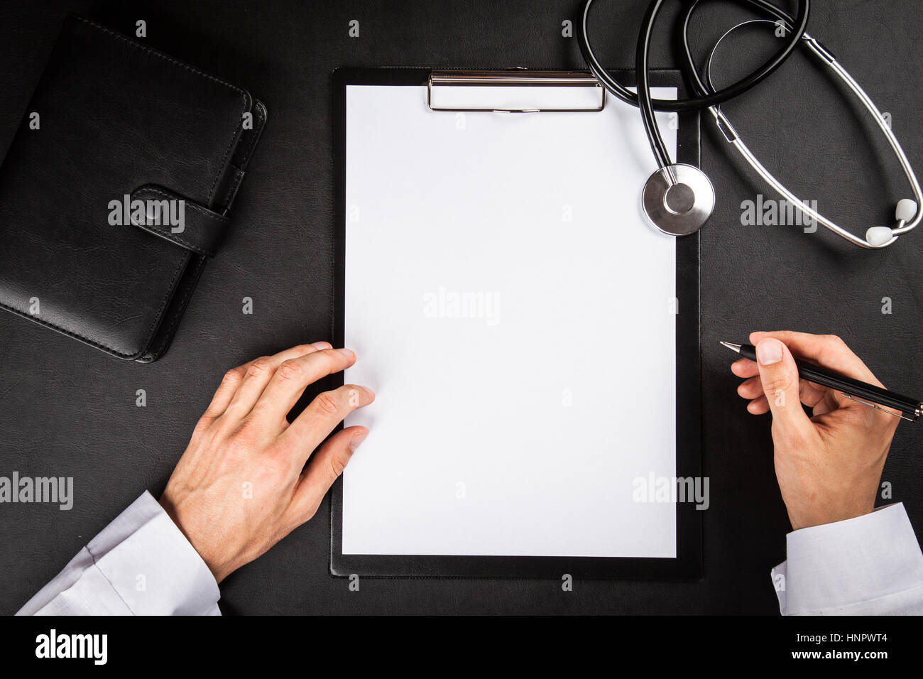 Doctor's working table Stock Photo - Alamy