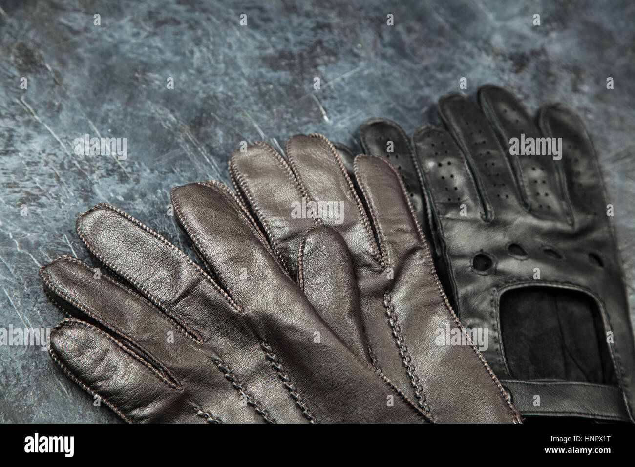 Two pairs of leather gloves Stock Photo - Alamy