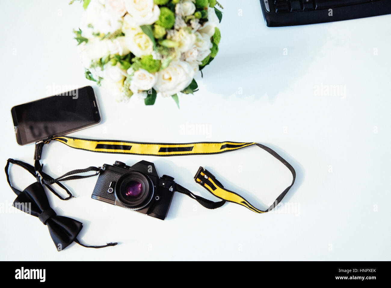 Photo retro camera on a table with different objects Stock Photo - Alamy