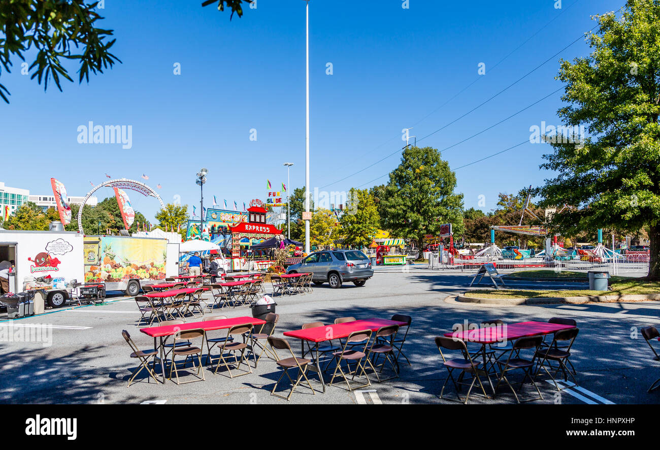 An empty carnival , amusement park, or fair in a parking lot Stock ...