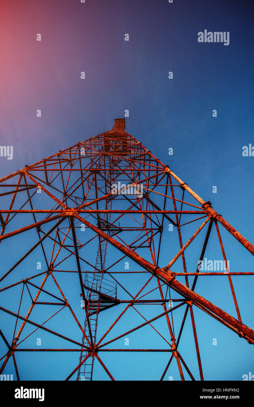 High metal tower on blue sky. Large scale Stock Photo - Alamy