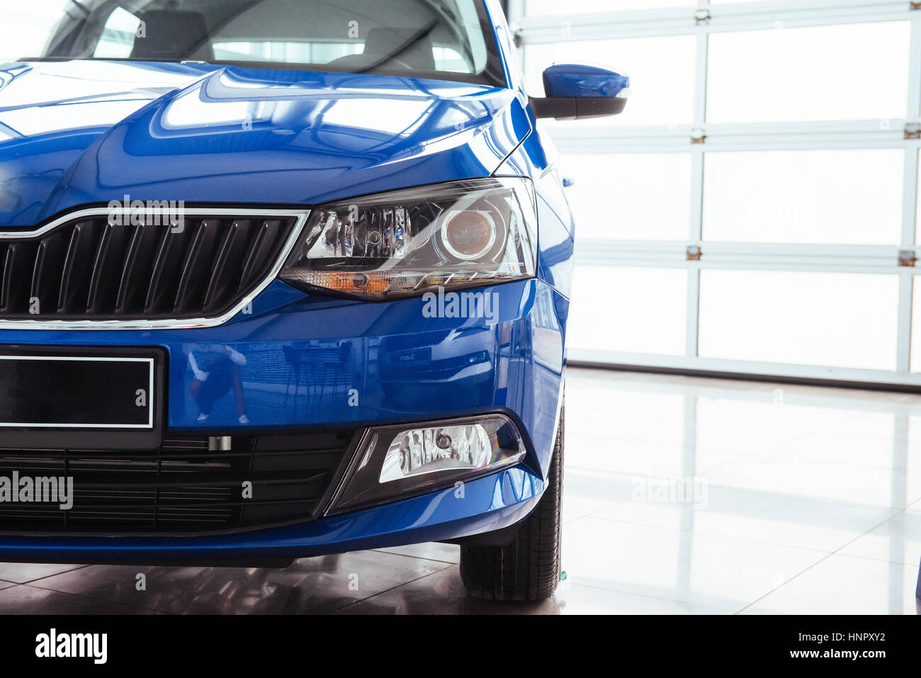 The headlights and hood Blue sports car Stock Photo - Alamy