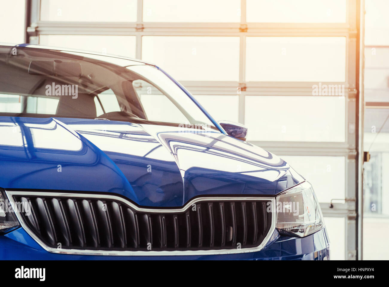 The headlights and hood Blue sports car Stock Photo - Alamy