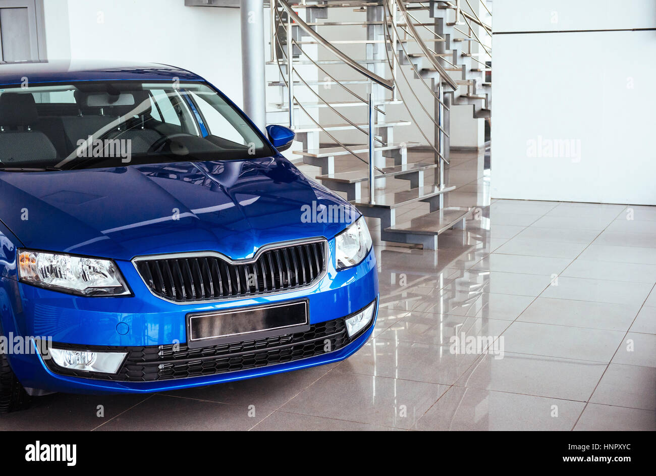 The headlights and hood Blue sports car Stock Photo - Alamy