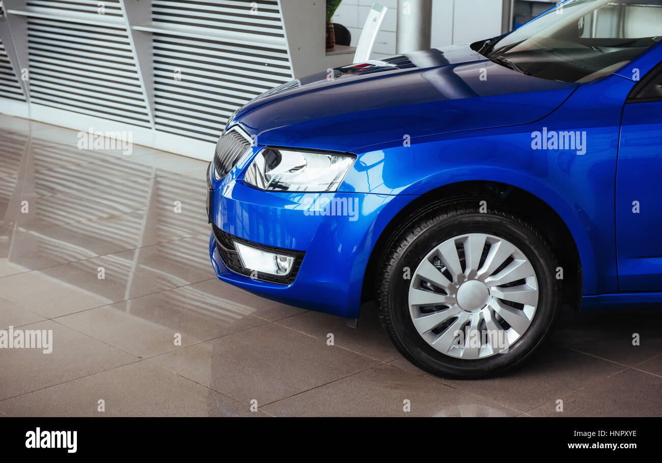The headlights and hood Blue sports car Stock Photo - Alamy